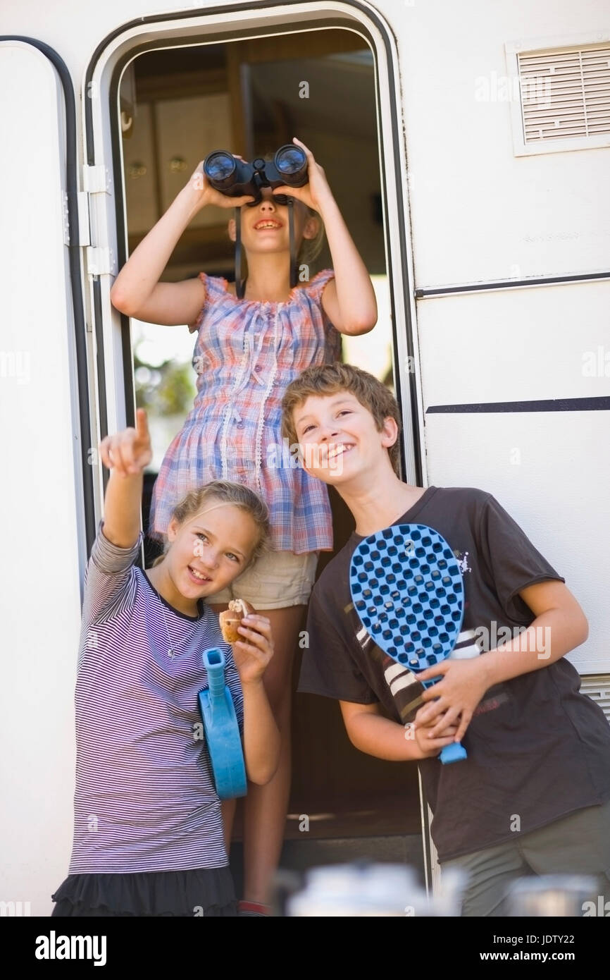 Children using binoculars outside RV Stock Photo - Alamy