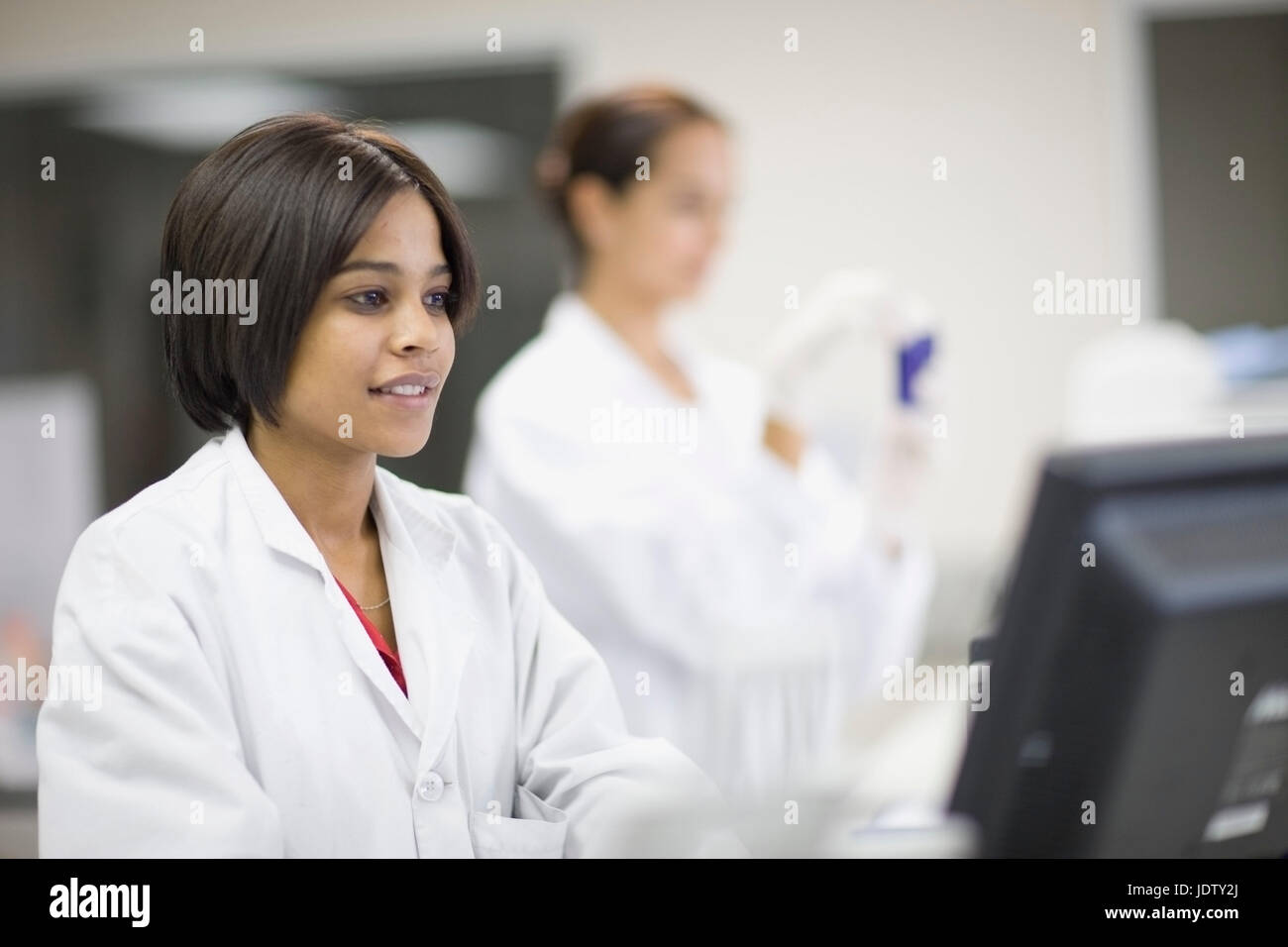 Scientist using computer in lab Stock Photo - Alamy Scientist using computer in lab Stock Photo - Alamy