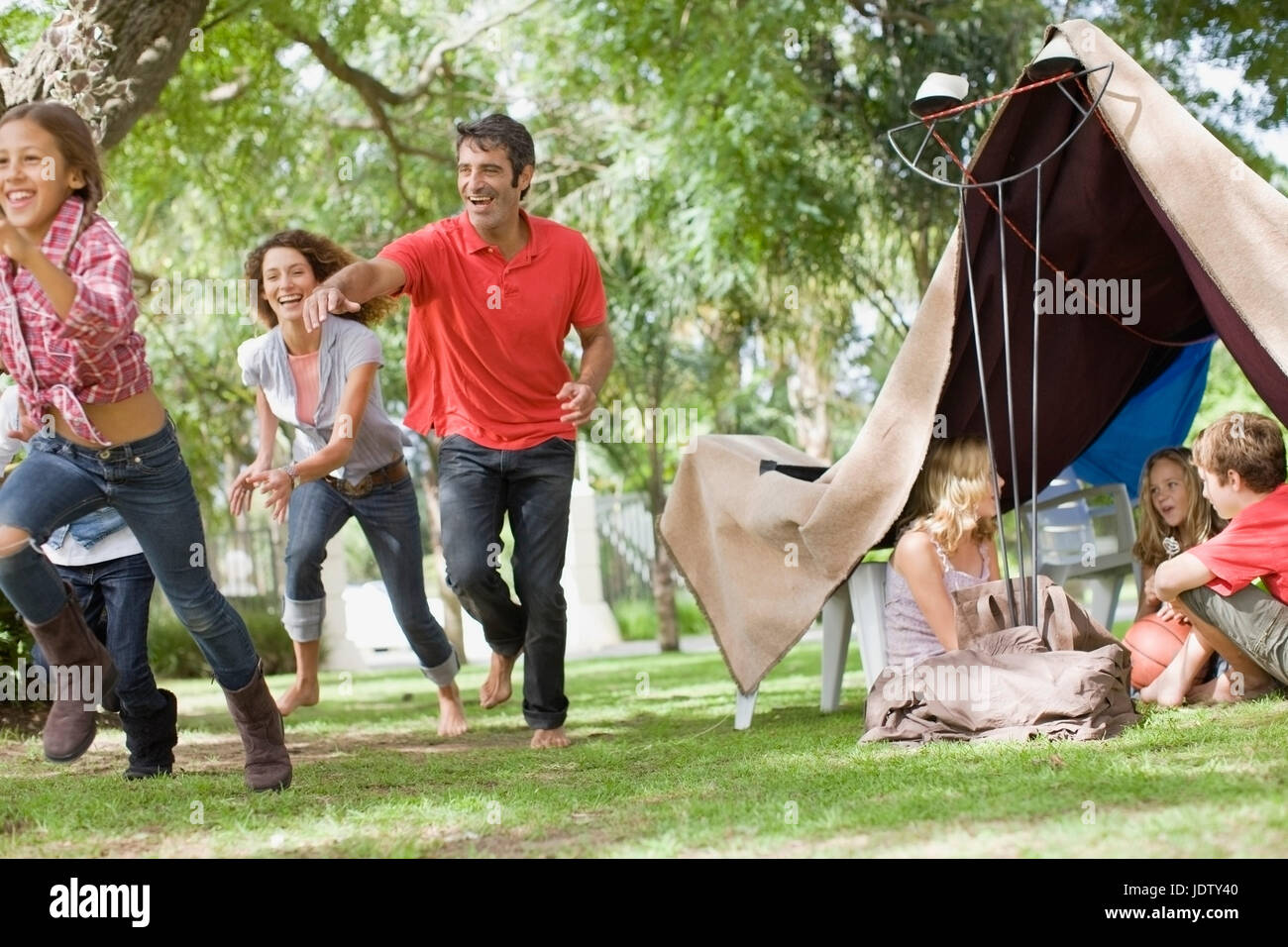 Family playing together in backyard Stock Photo - Alamy