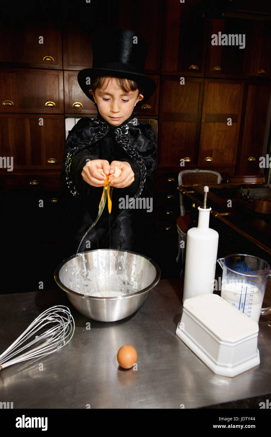 Boy magician cooking in kitchen Stock Photo - Alamy