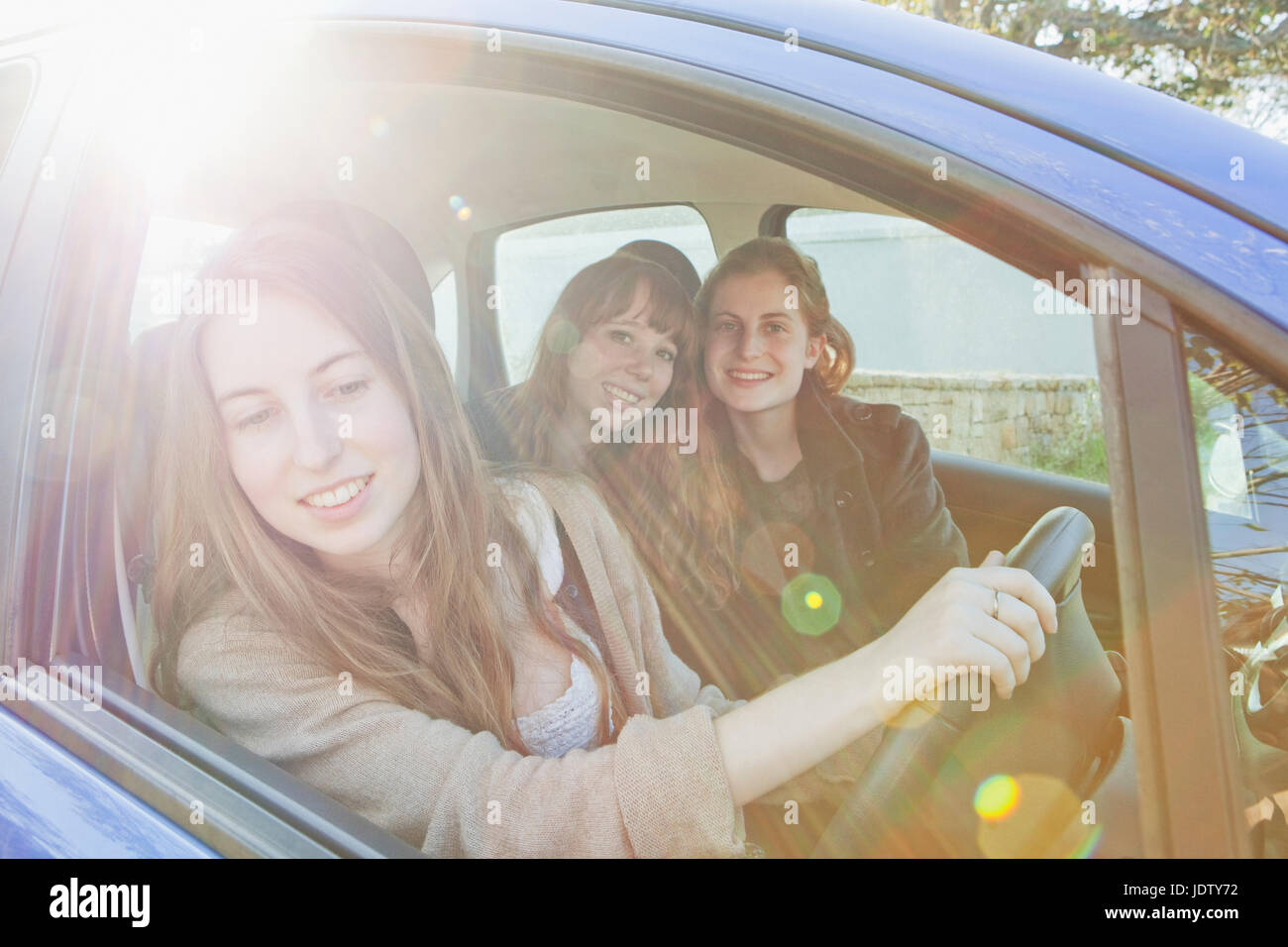 Teenage girls riding in car together Stock Photo - Alamy