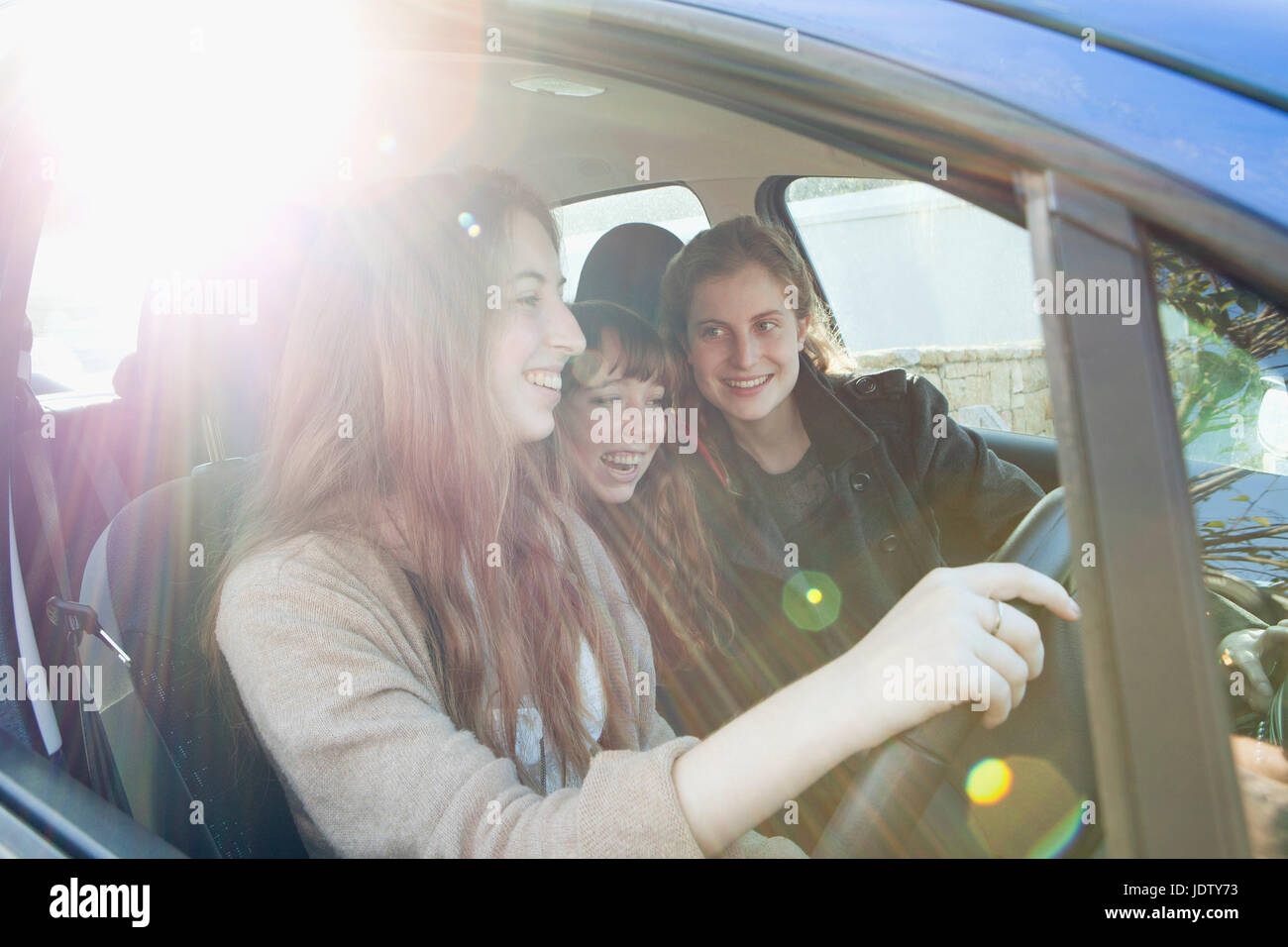 Teenage girls riding in car together Stock Photo - Alamy