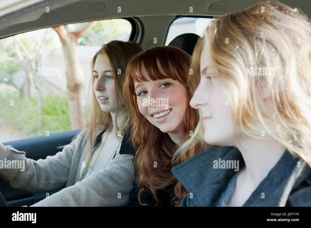 Teenage girls riding in car together Stock Photo - Alamy