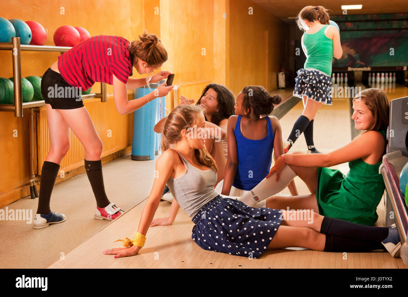 Teenage girls bowling together Stock Photo - Alamy