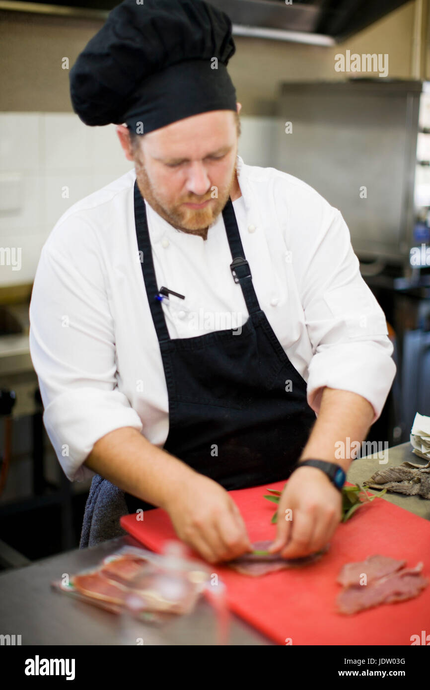 Chef at work in kitchen Stock Photo - Alamy