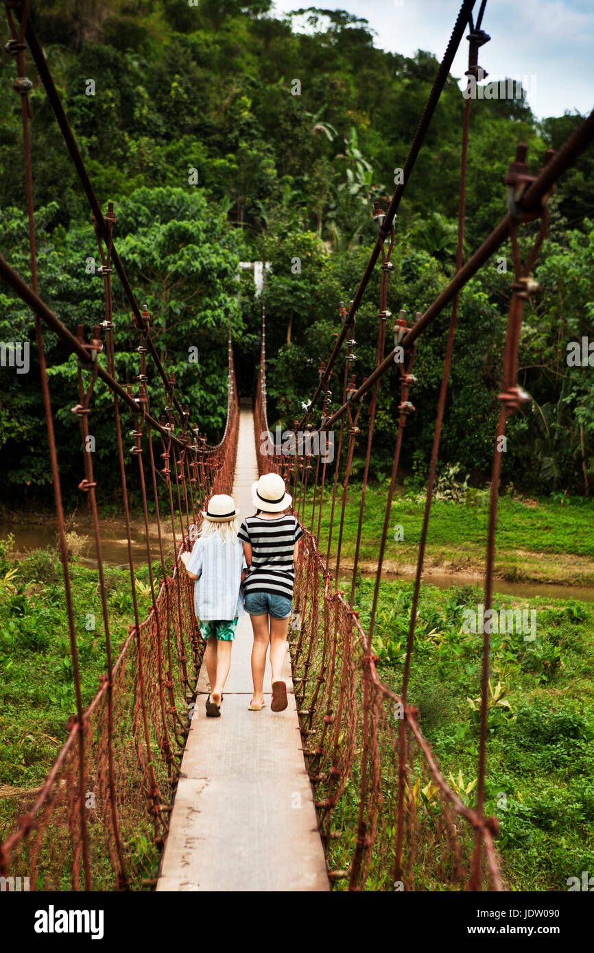 Child crossing rope bridge hi-res stock photography and images - Alamy