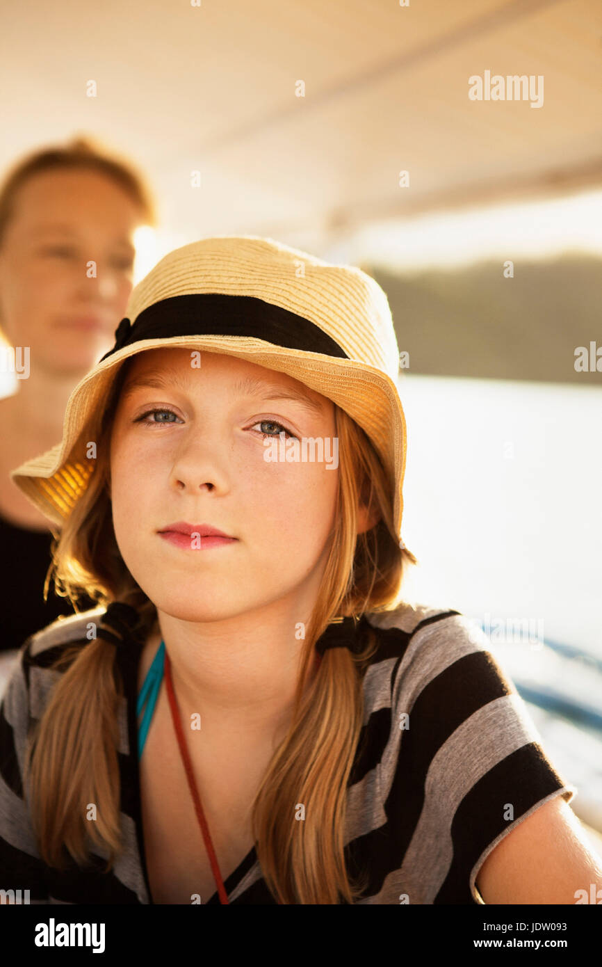 Girl wearing straw hat outdoors Stock Photo - Alamy