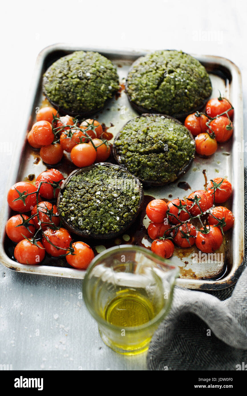 Platter of tomatoes and herbed patties Stock Photo - Alamy