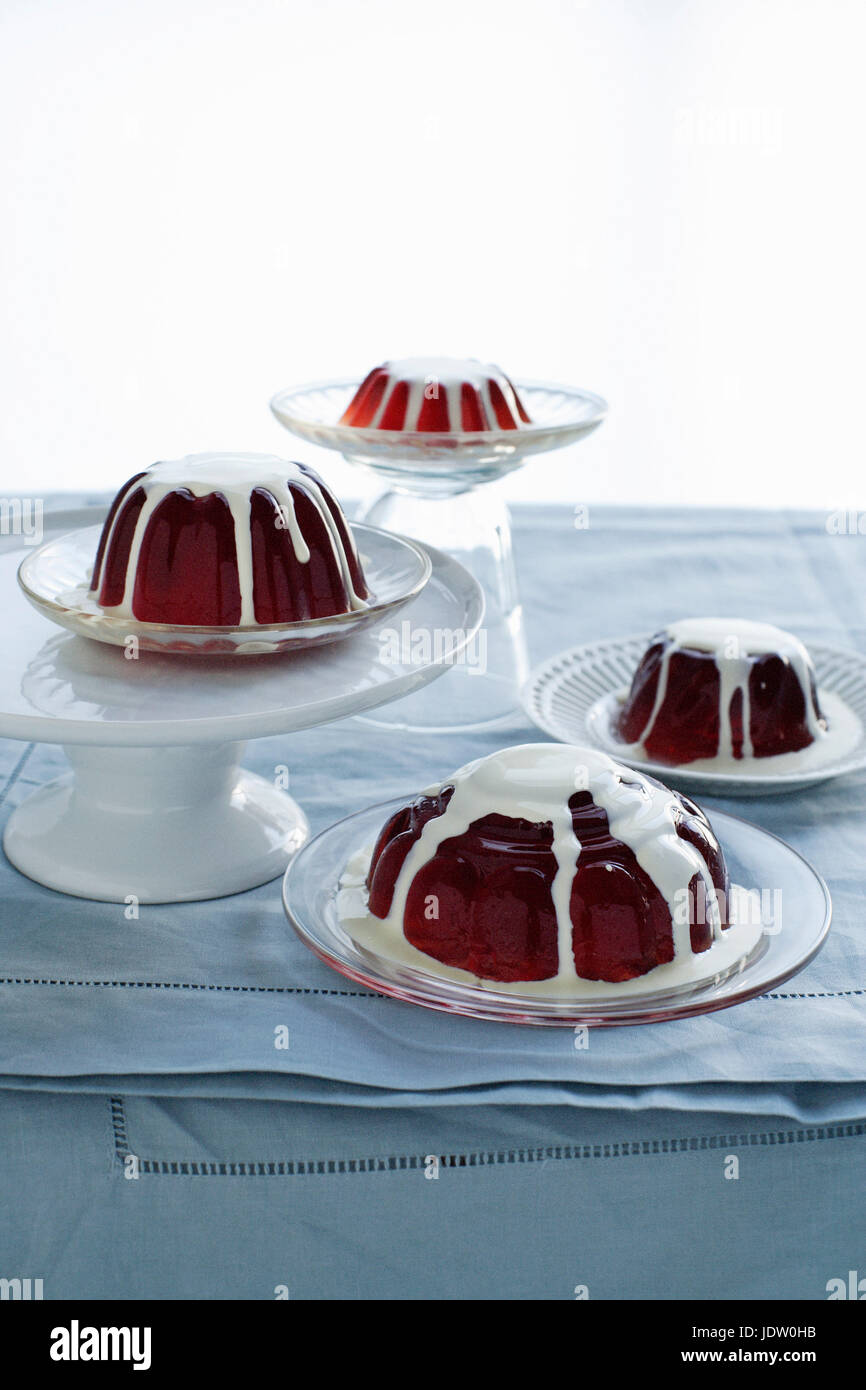 Plates of jello pudding with cream Stock Photo - Alamy