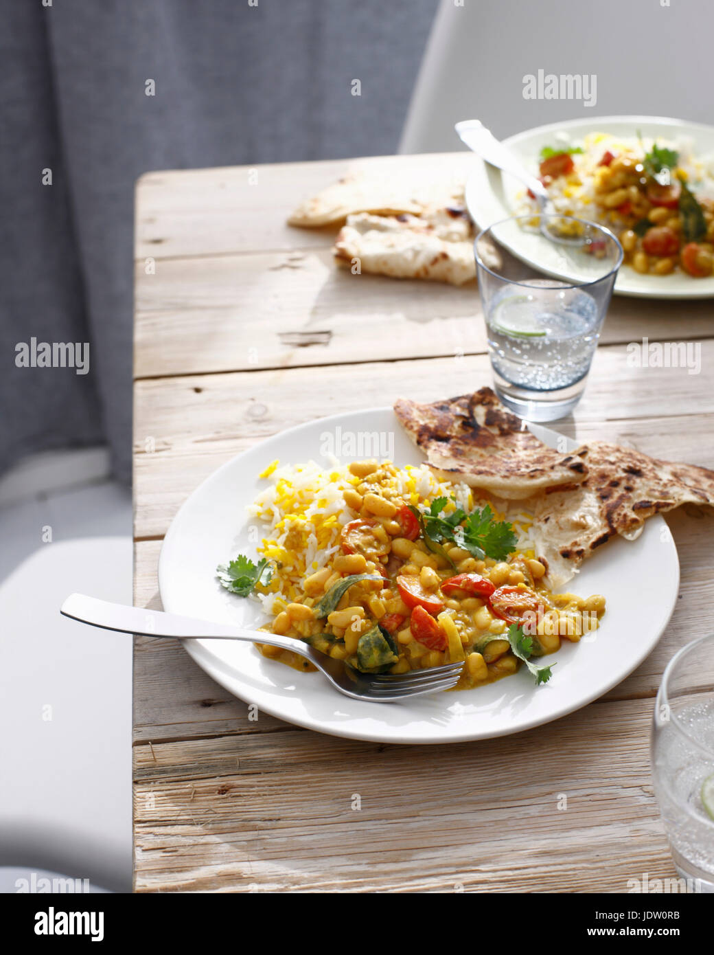 Plate of bean curry with rice and bread Stock Photo - Alamy