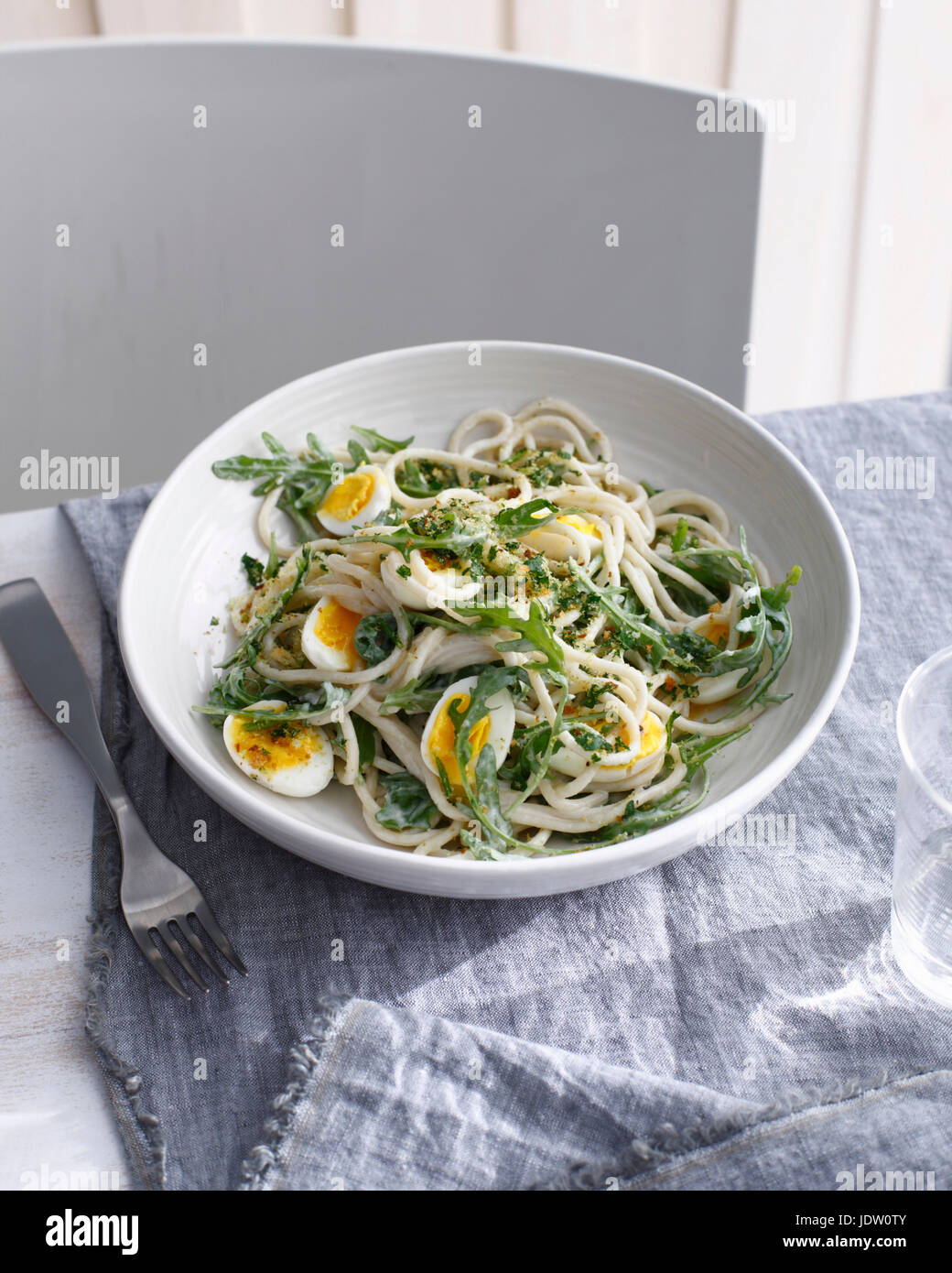 Bowl of pasta with quail eggs Stock Photo - Alamy