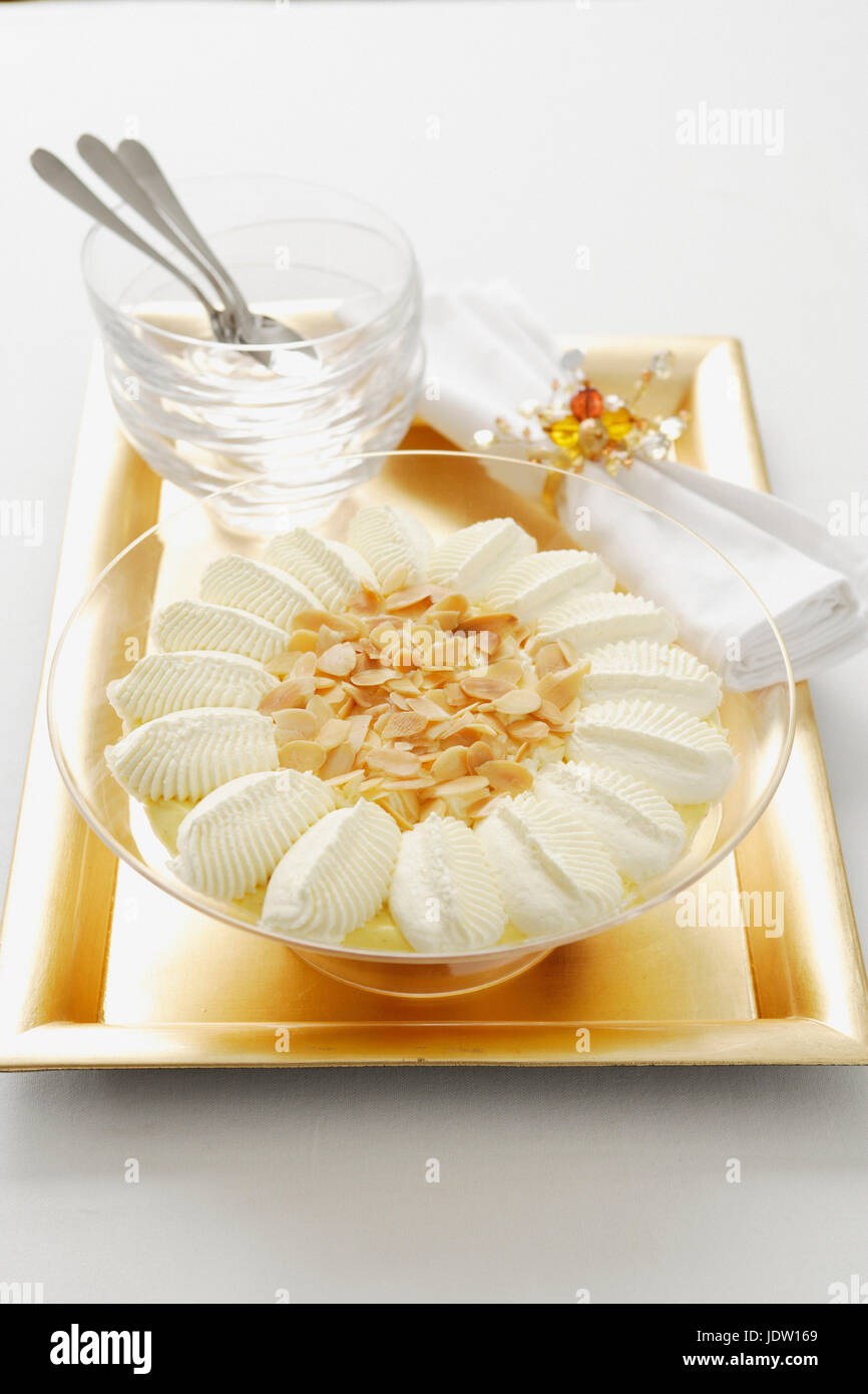 Bowl of custard with nuts and cream Stock Photo - Alamy