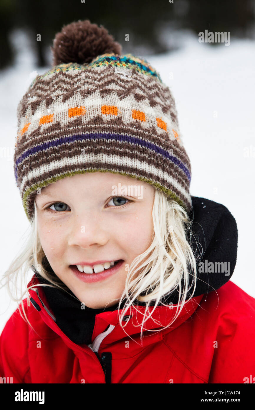 Close up of girls smiling face in snow Stock Photo - Alamy