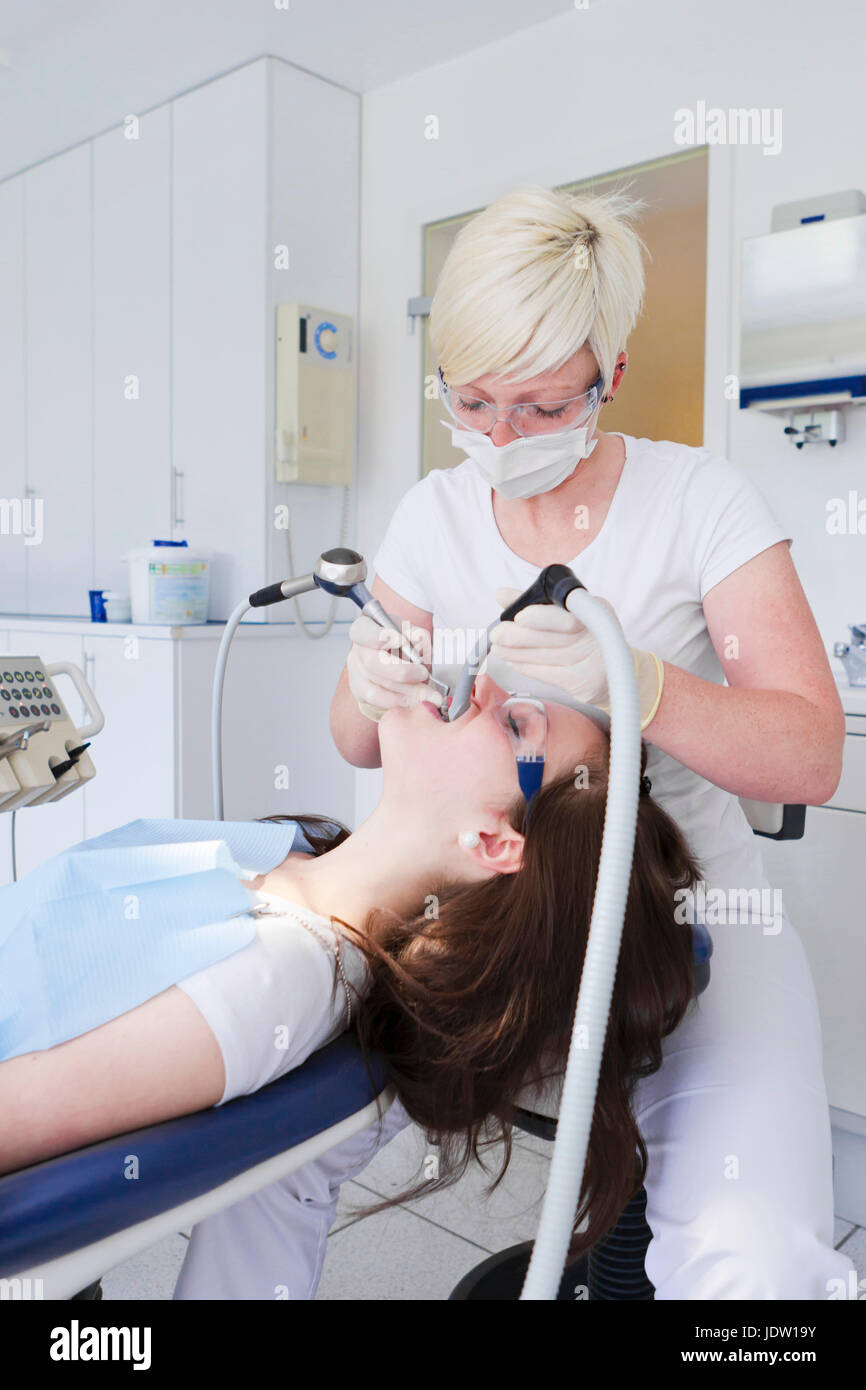 Dentist working on patients teeth Stock Photo - Alamy