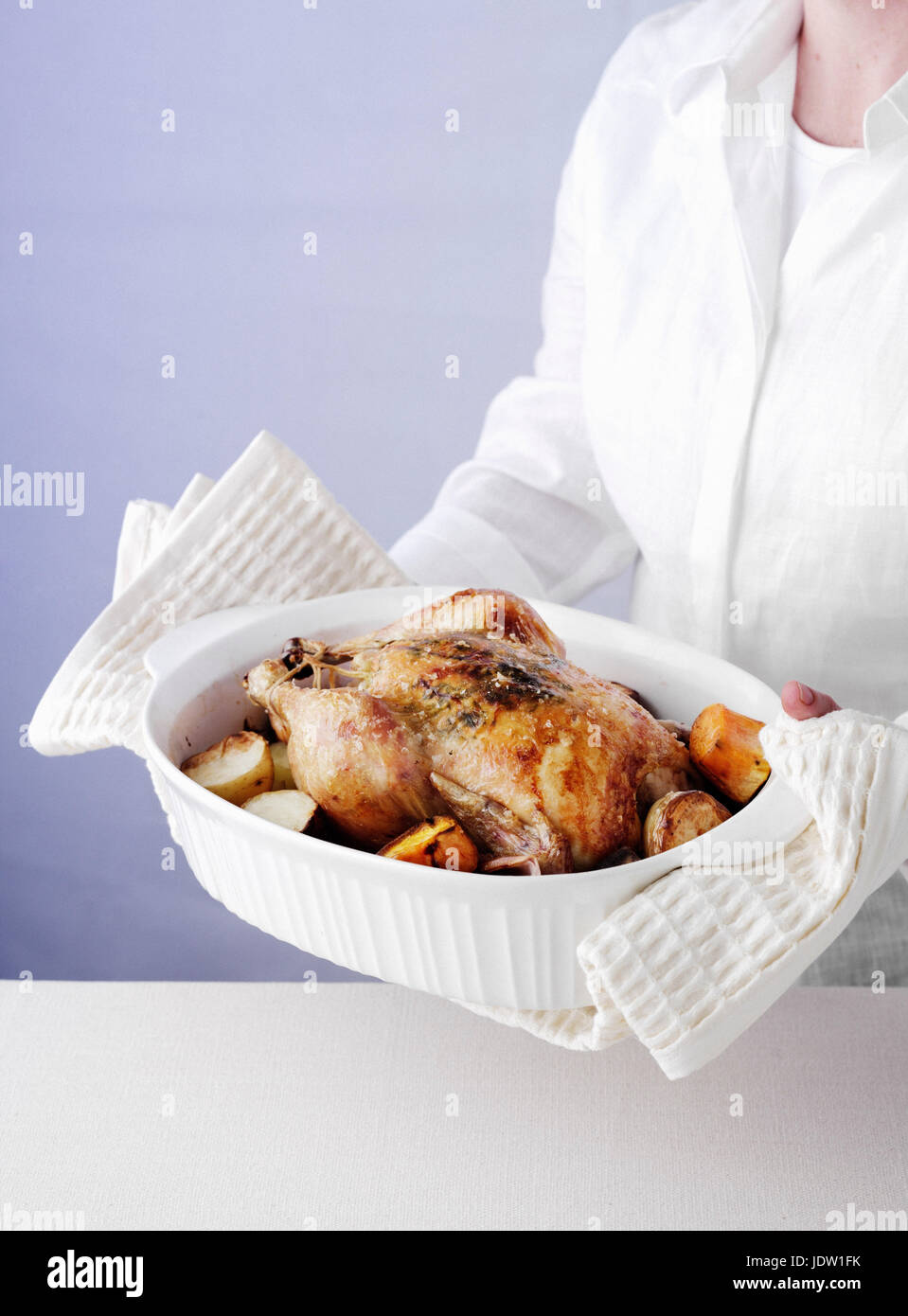 Woman cooking whole baked chicken hi-res stock photography and images ...