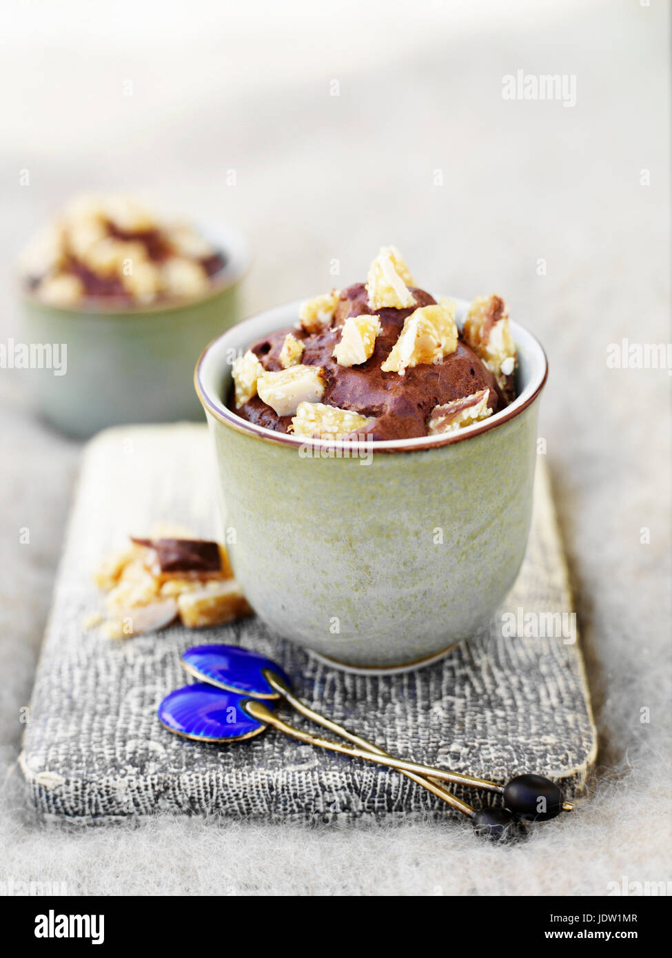 Cup of chocolate pudding with topping Stock Photo - Alamy