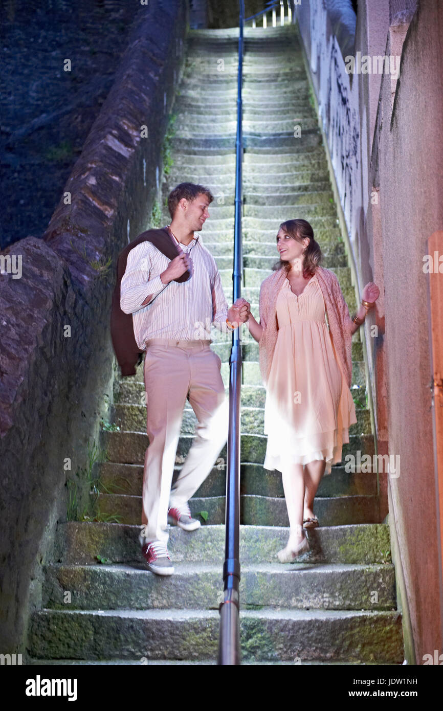 Couple talking on urban steps Stock Photo - Alamy