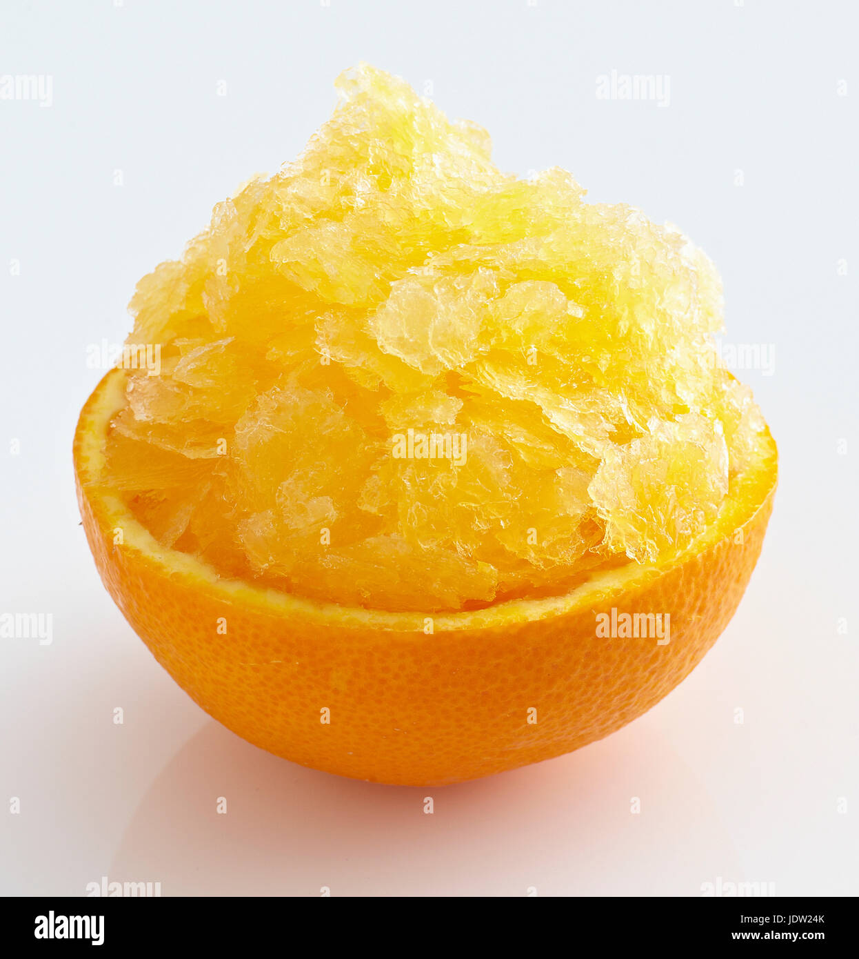 Close up of shave ice in orange peel Stock Photo - Alamy