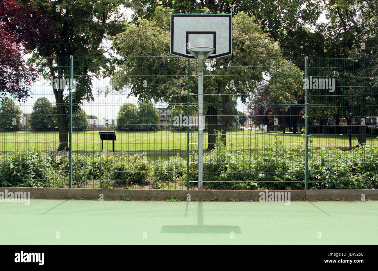Basketball court in city park Stock Photo - Alamy