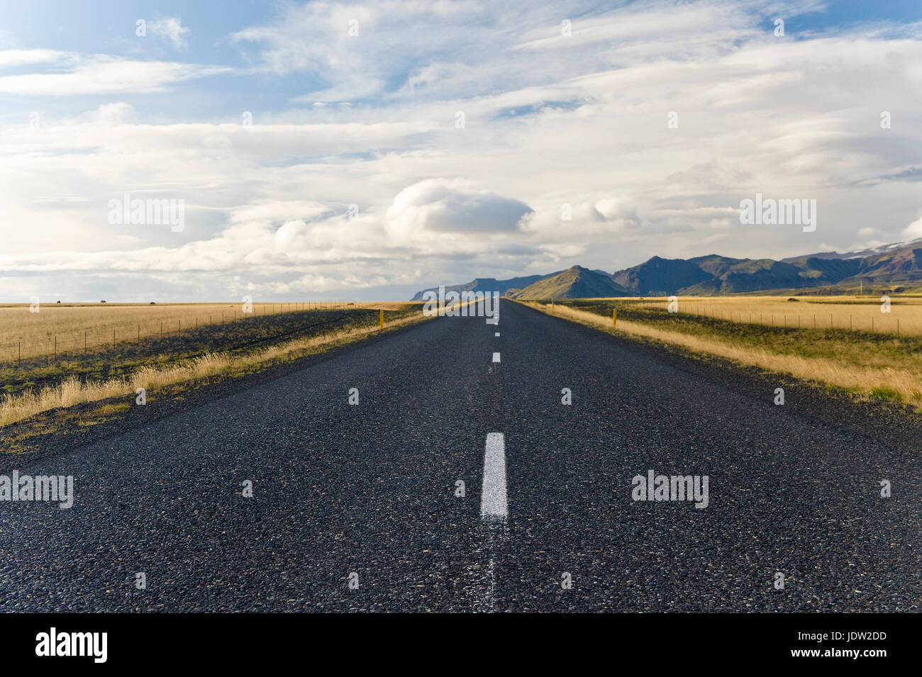 Paved road in rural landscape Stock Photo - Alamy