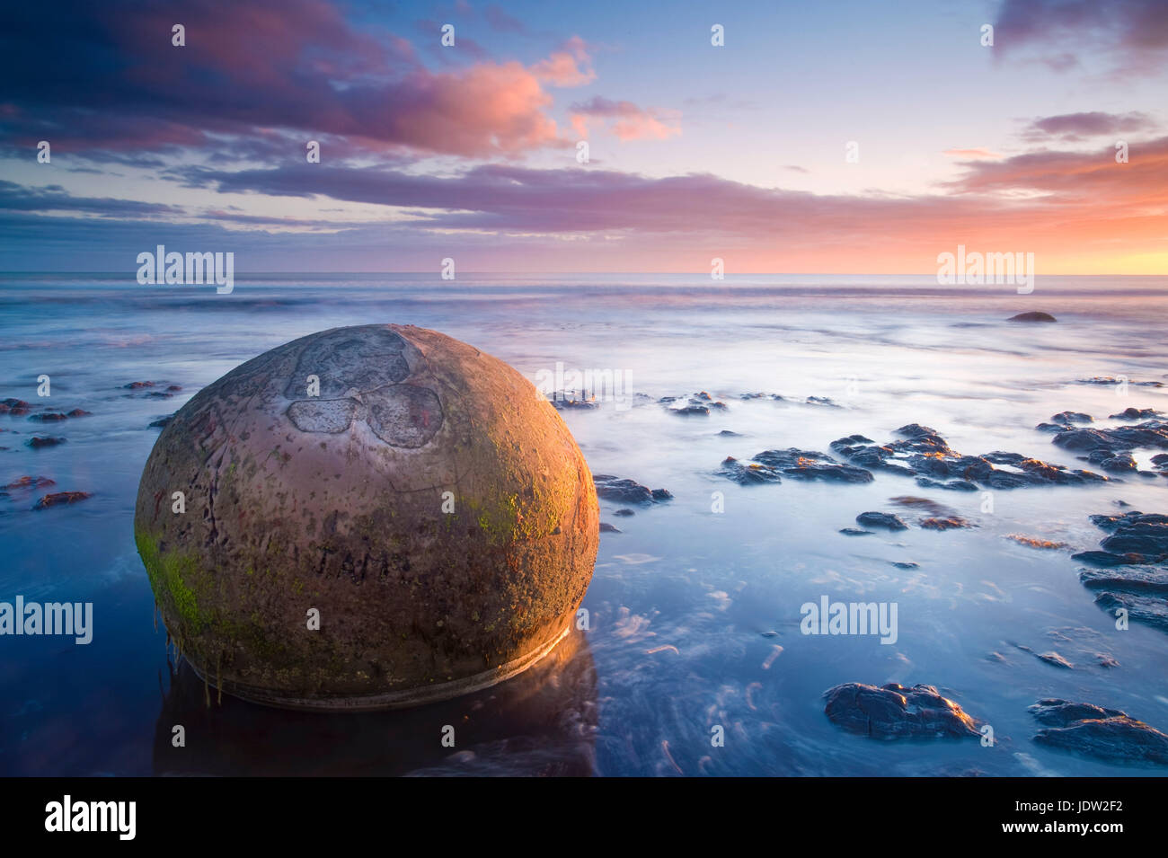 Graffiti on rock at beach Stock Photo - Alamy