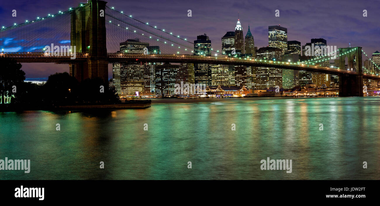 City skyline and bridge lit up at night Stock Photo - Alamy