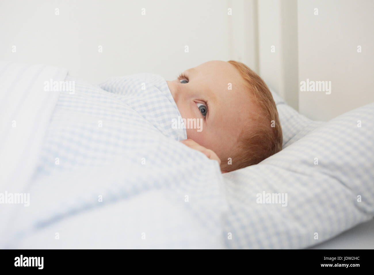 Child tucked bed hi-res stock photography and images - Alamy