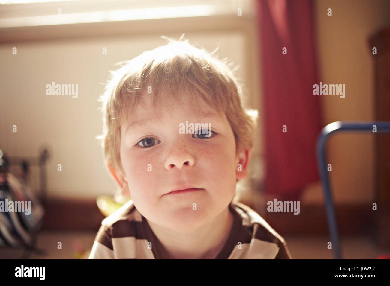 Close up of boy's curious face Stock Photo - Alamy