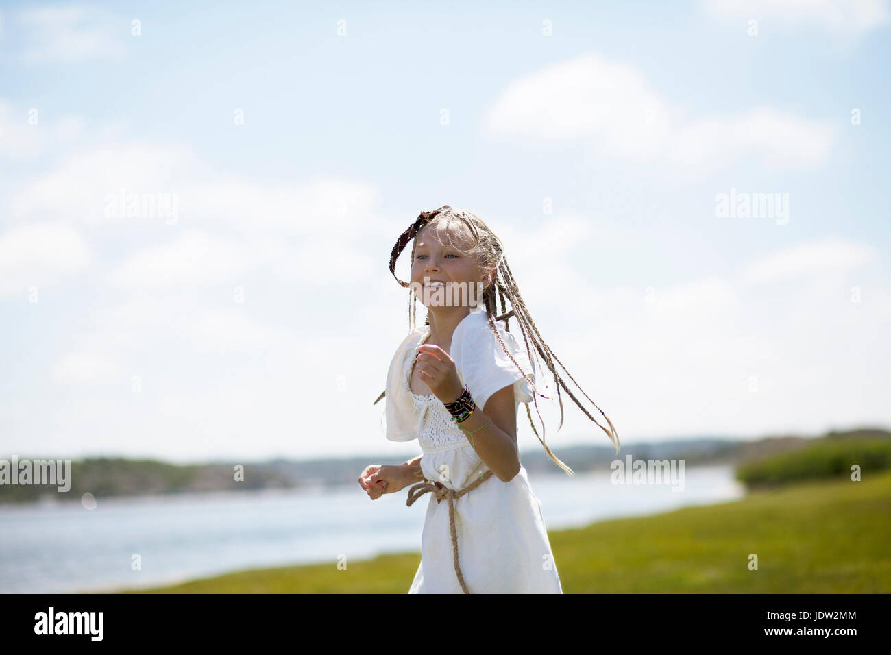 Girl running in Native American costume Stock Photo - Alamy