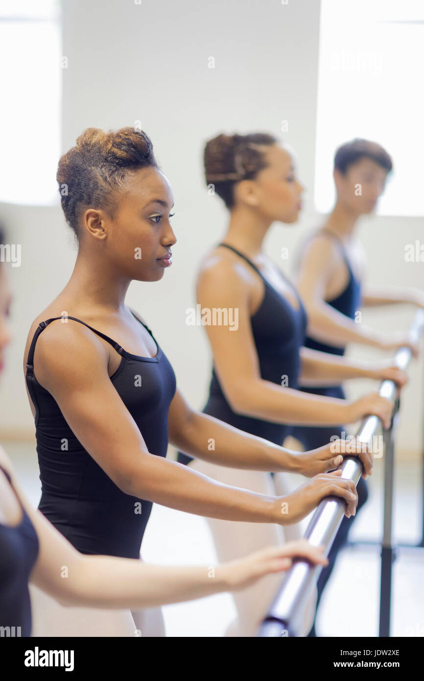 Ballet dancers practicing at barre Stock Photo - Alamy