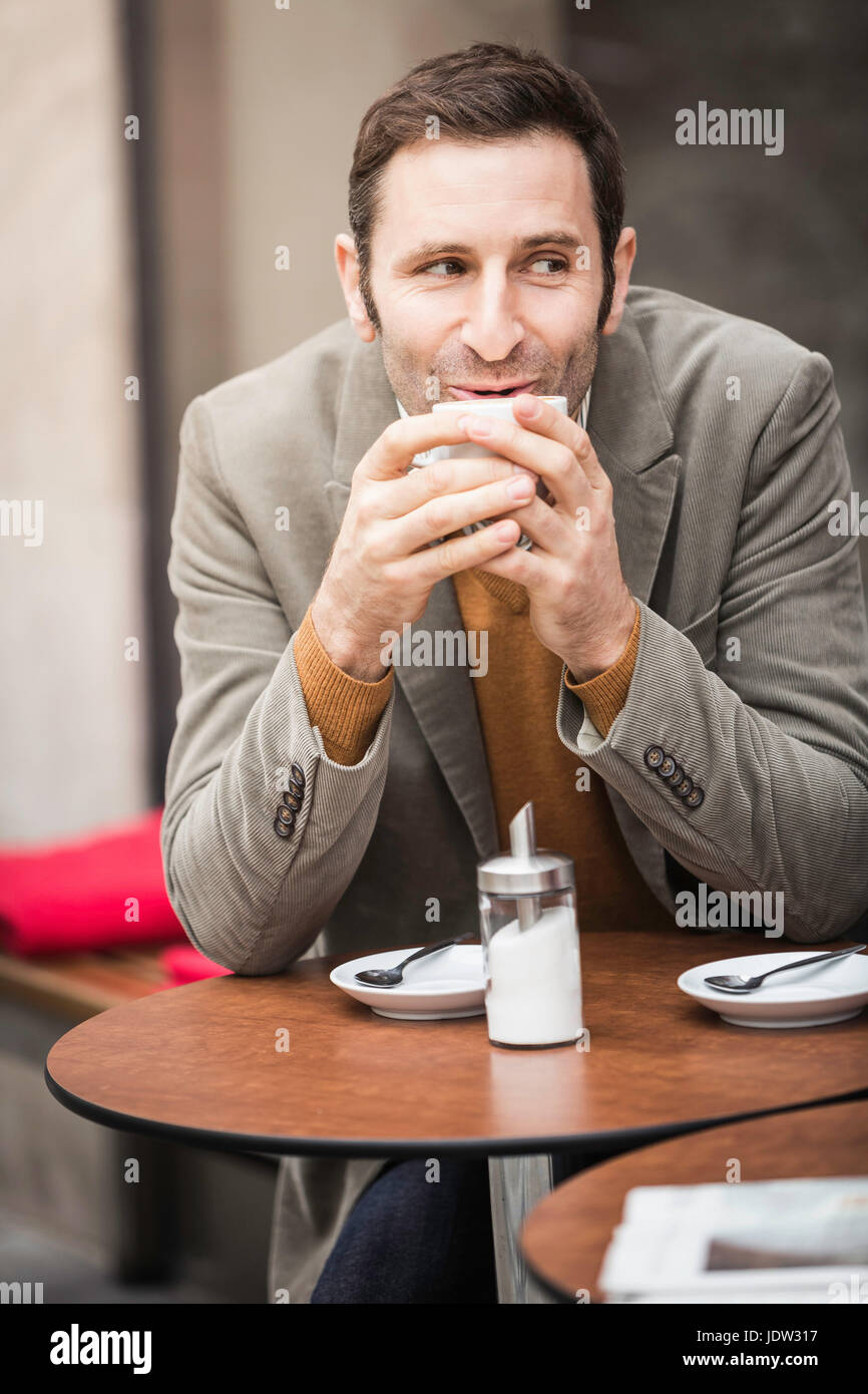 Man alone cafe blur hi-res stock photography and images - Alamy