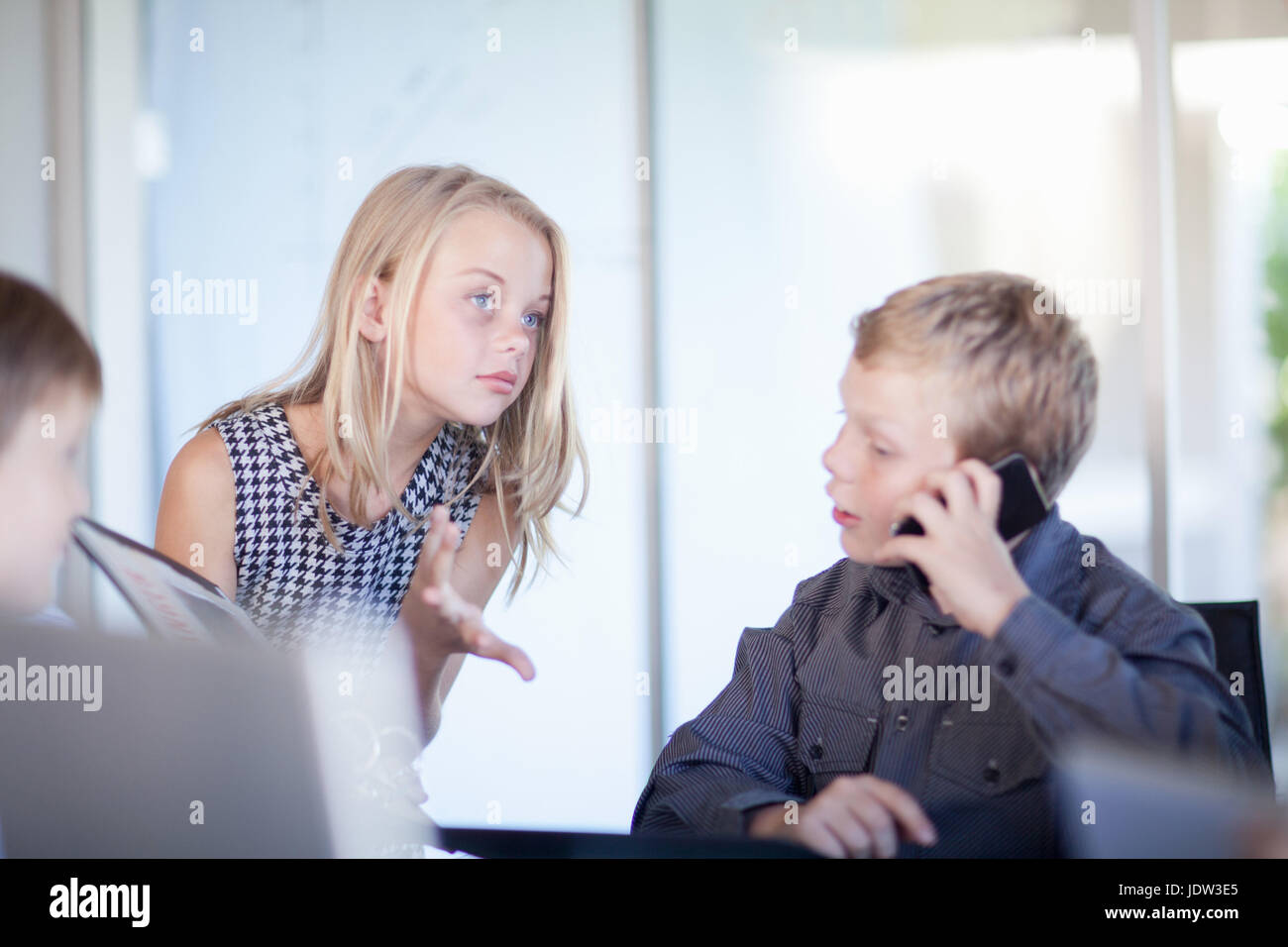 Children playing business people at desk Stock Photo - Alamy