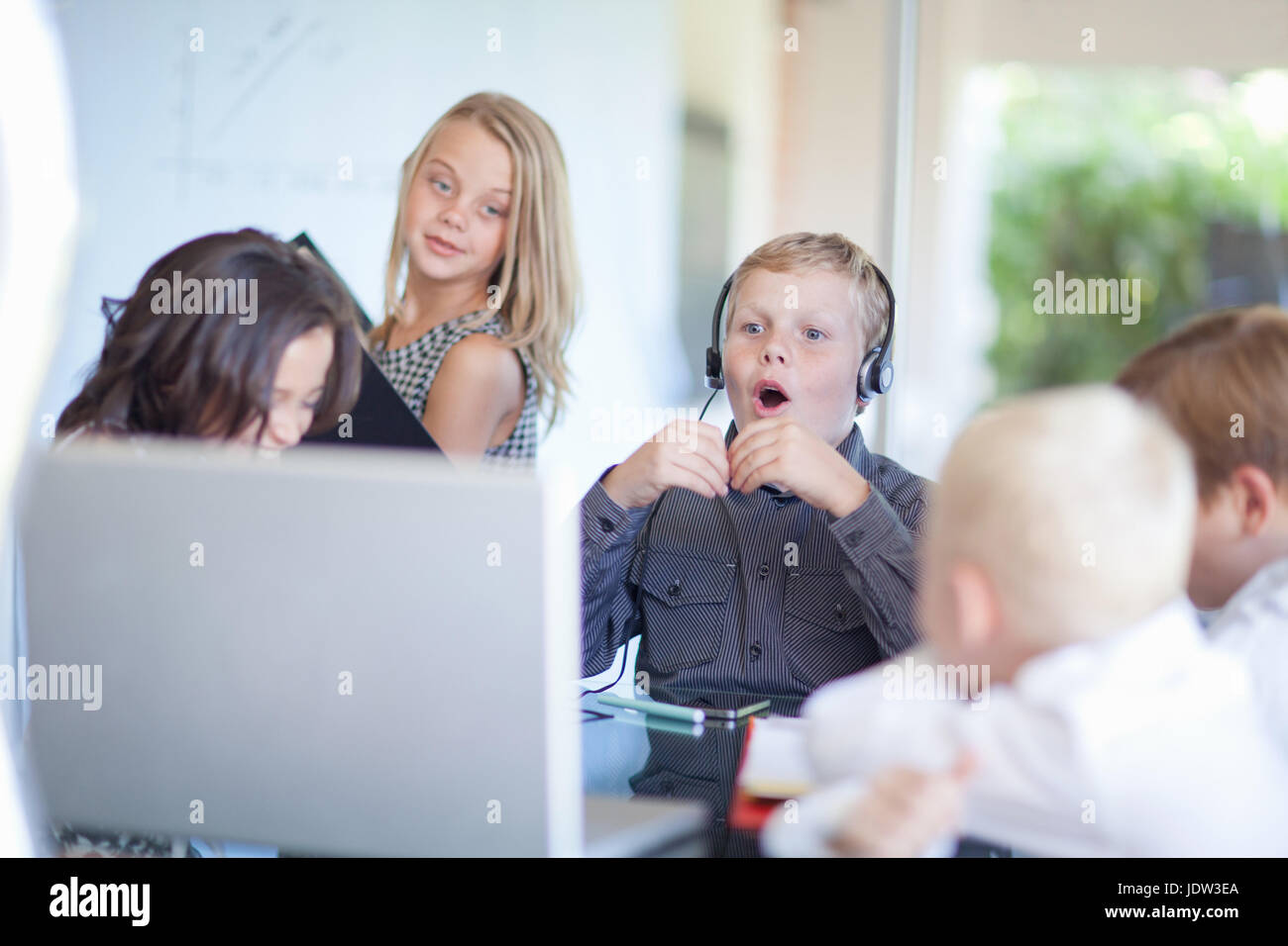 Children playing business people at desk Stock Photo - Alamy