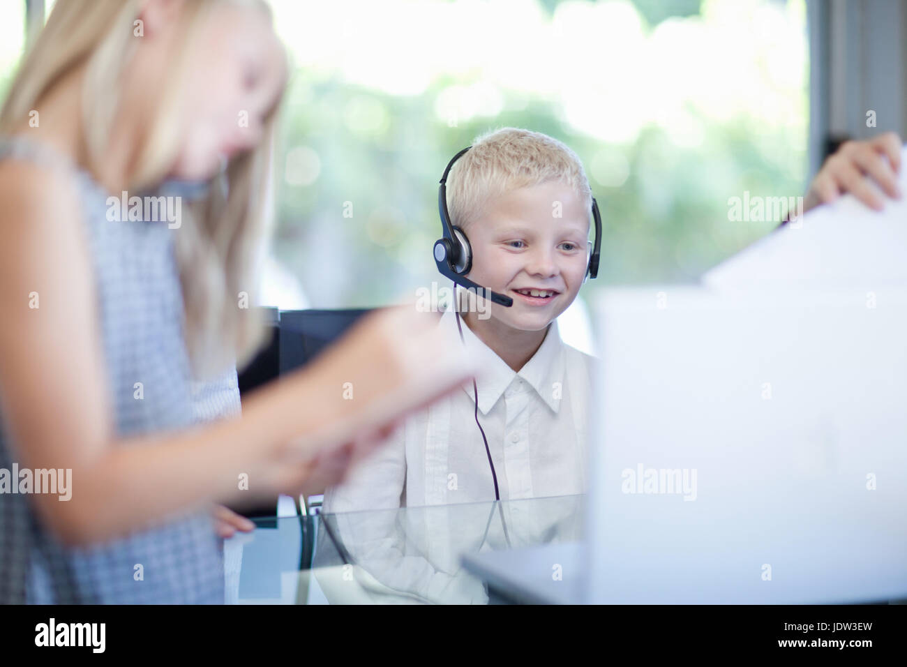 Children playing business people at desk Stock Photo - Alamy