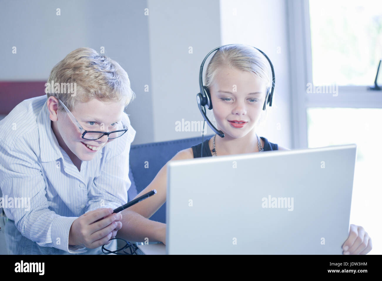 Children playing business people at desk Stock Photo - Alamy