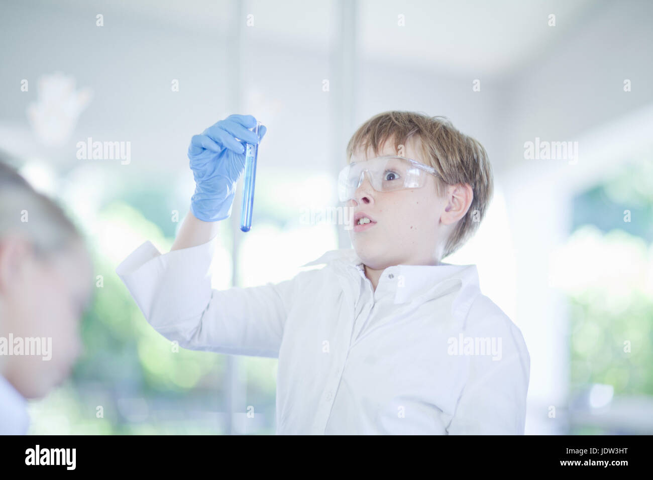 Boy playing scientist in lab Stock Photo - Alamy