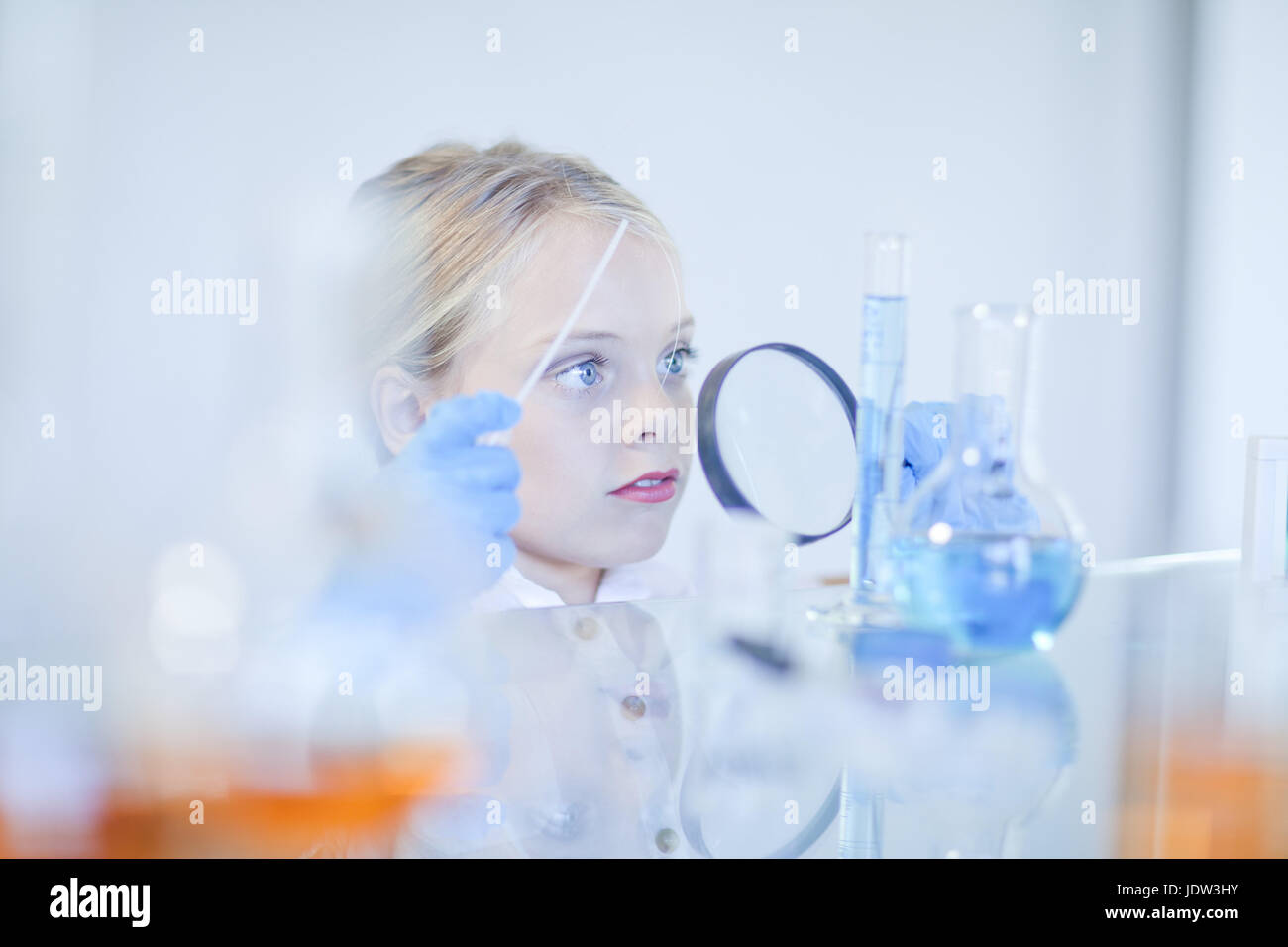 Girl playing scientist in lab Stock Photo - Alamy