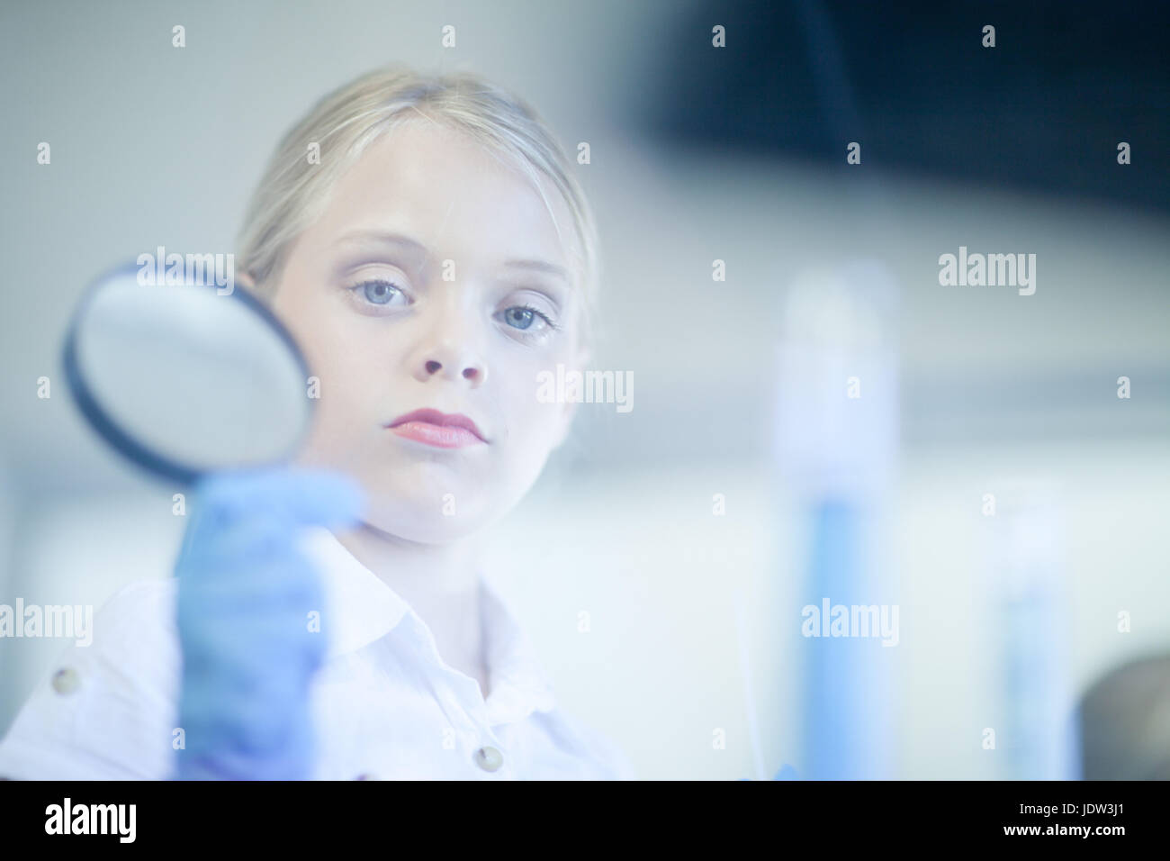 Girl playing scientist in lab Stock Photo - Alamy