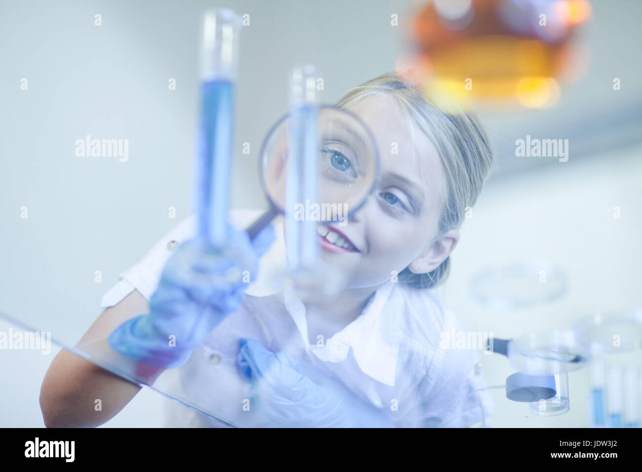 Girl playing scientist in lab Stock Photo - Alamy