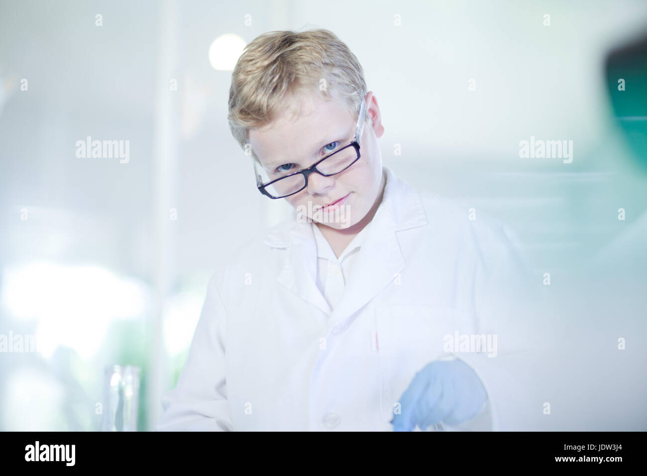 Boy playing scientist in lab Stock Photo - Alamy