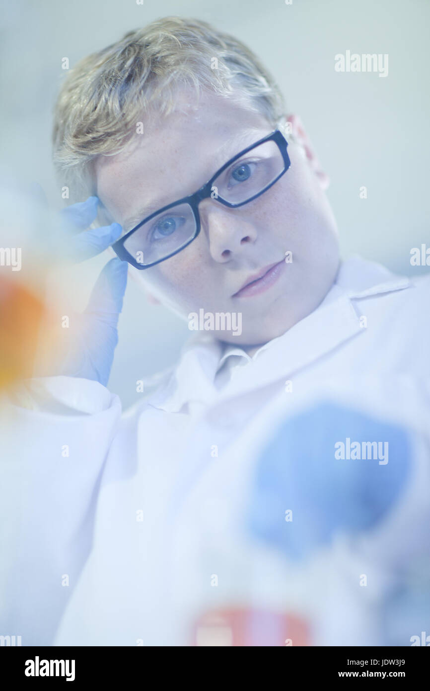 Boy playing scientist in lab Stock Photo - Alamy