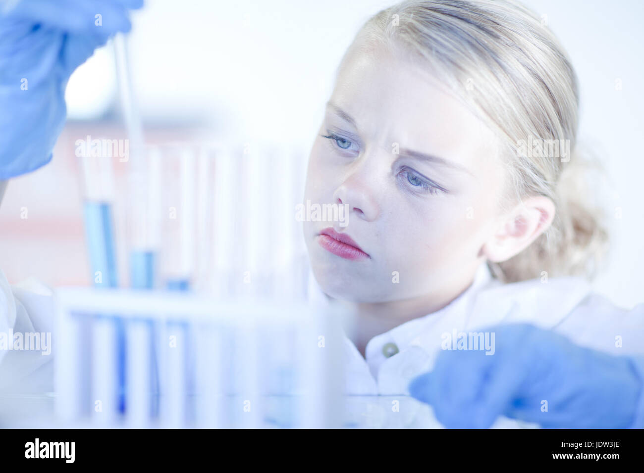 Girl playing scientist in lab Stock Photo - Alamy