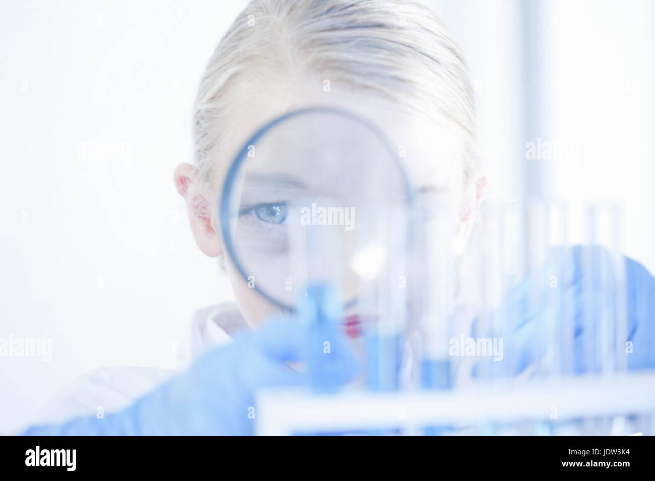 Girl playing scientist in lab Stock Photo - Alamy
