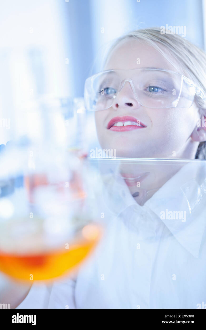 Girl playing scientist in lab Stock Photo - Alamy