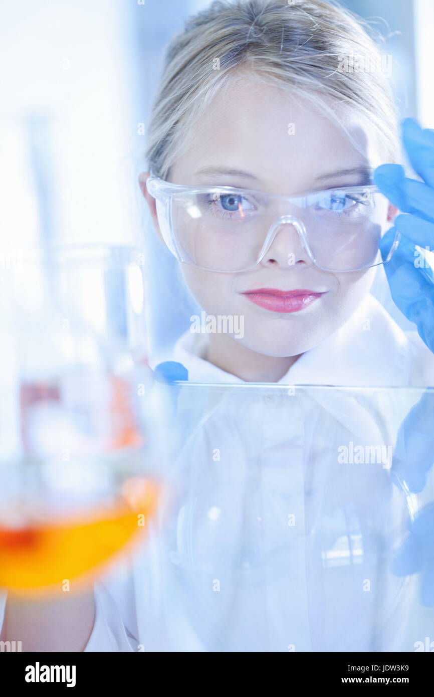 Girl playing scientist in lab Stock Photo - Alamy