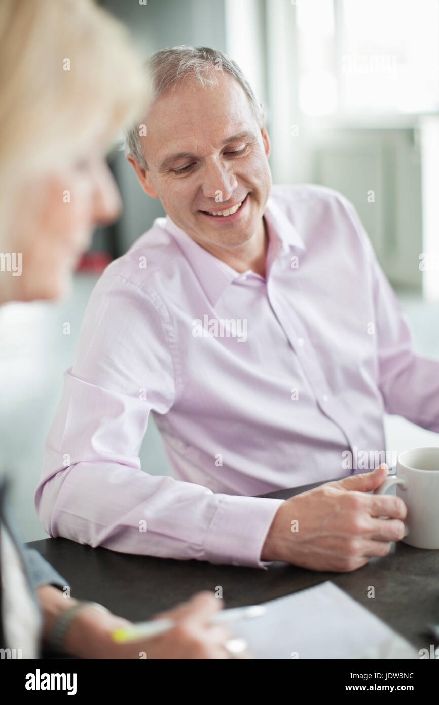 Two people sitting down talking hi-res stock photography and images - Alamy