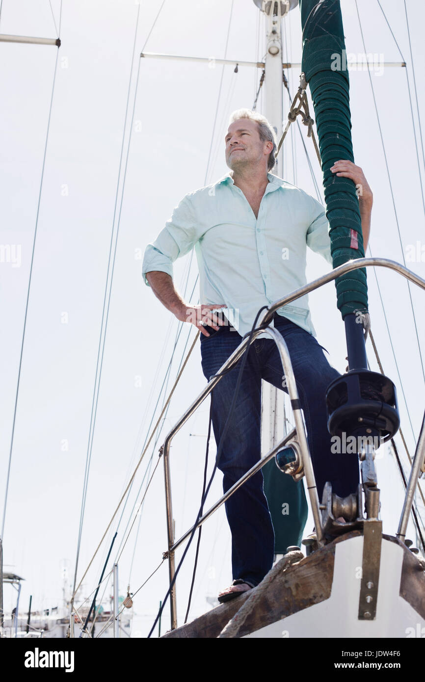 Man standing on yacht hi-res stock photography and images - Alamy