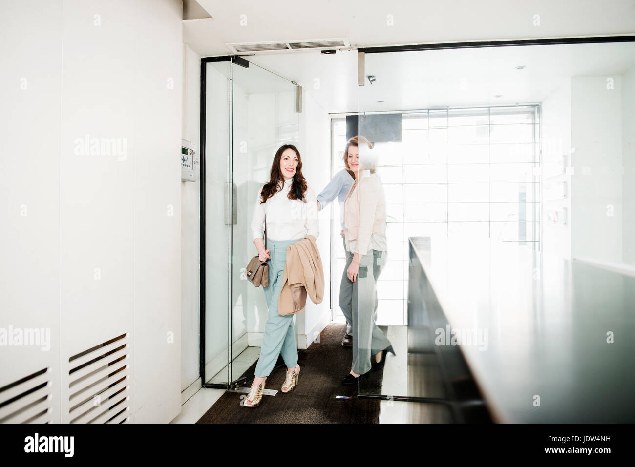 Business people walking through office hi-res stock photography and ...
