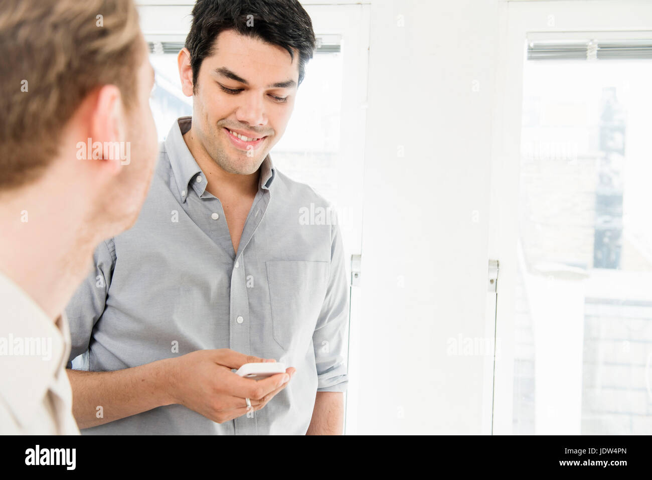 Man using cell phone Stock Photo - Alamy