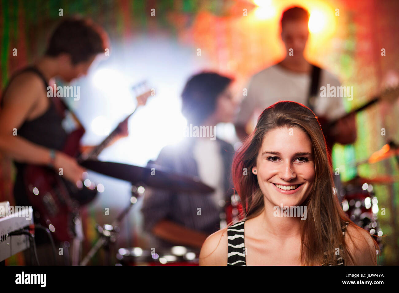 Teenagers at concert, teenage girl in foreground Stock Photo - Alamy
